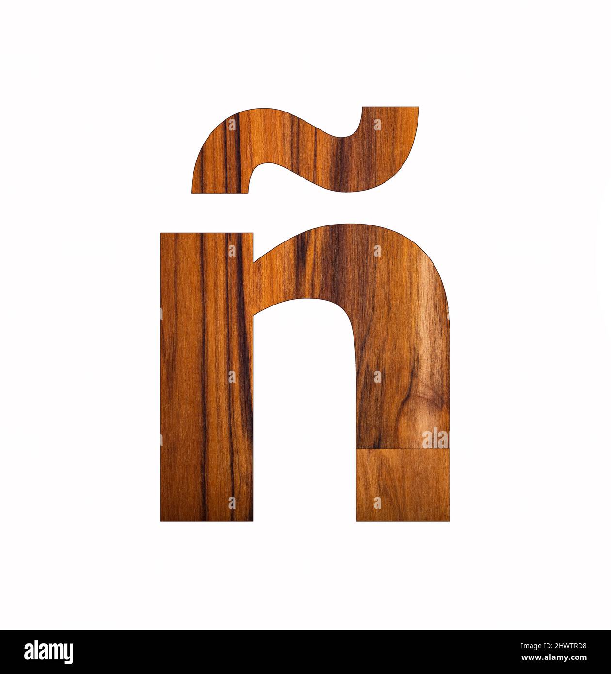 Alphabet letter Ñ on rustic wood background Stock Photo - Alamy
