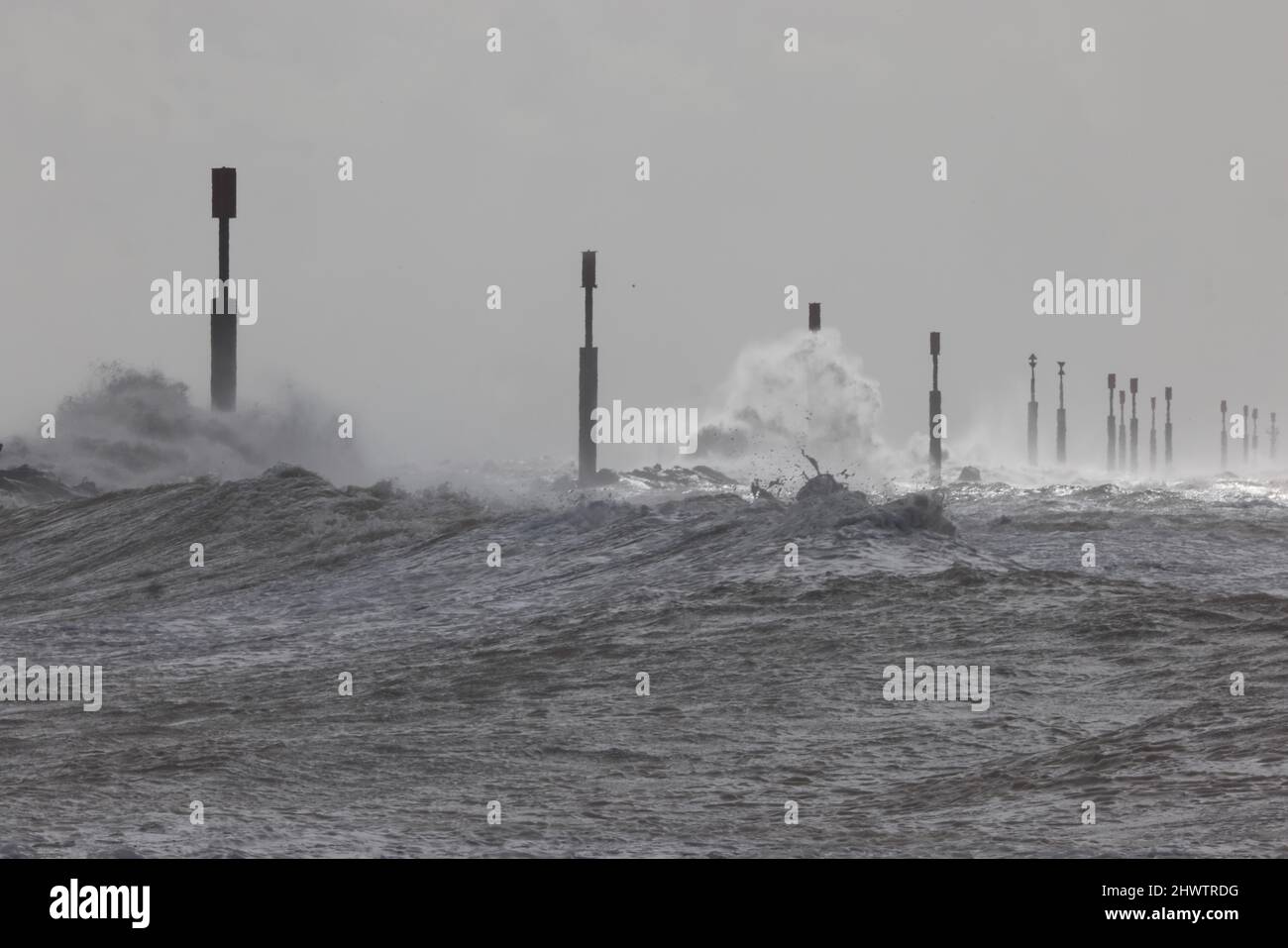 the North Sea breaking against the off-shore coastal defence reefs on a ...