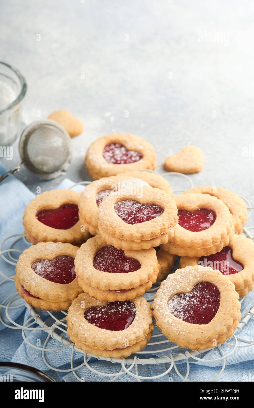 Traditional Linzer cookie with strawberry jam and powder sugar on light ...