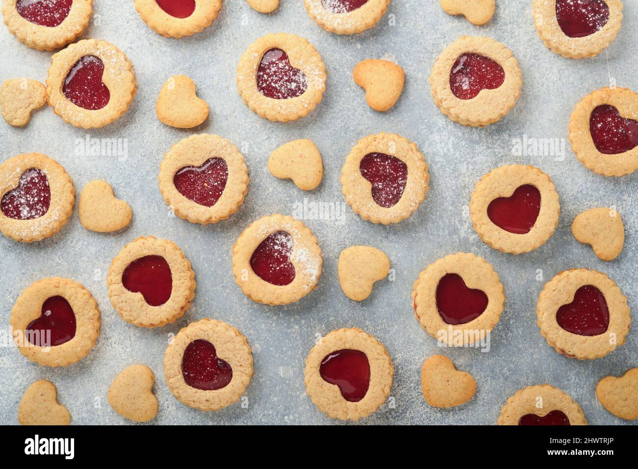 Traditional Linzer cookie with strawberry jam and powder sugar on light ...