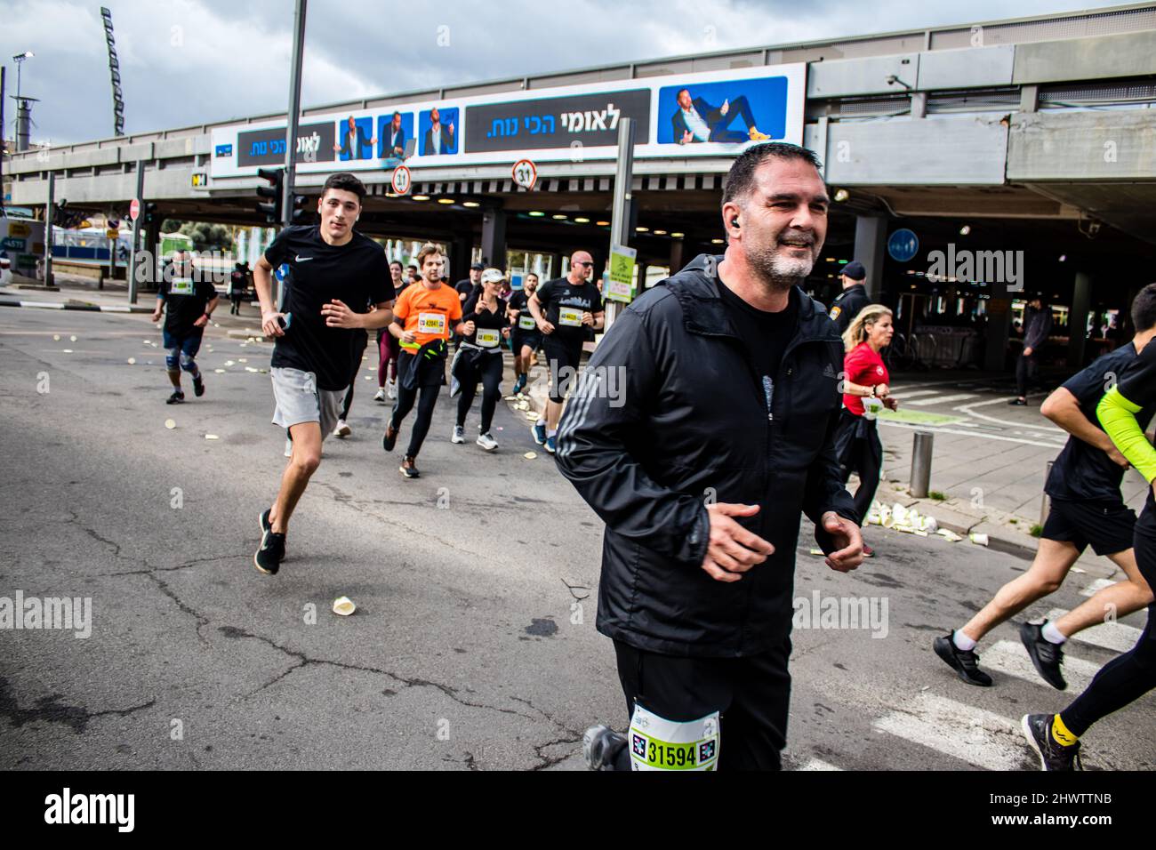 Tel Aviv, Israel - February 25, 2022 Runners in the street of Tel Aviv ...