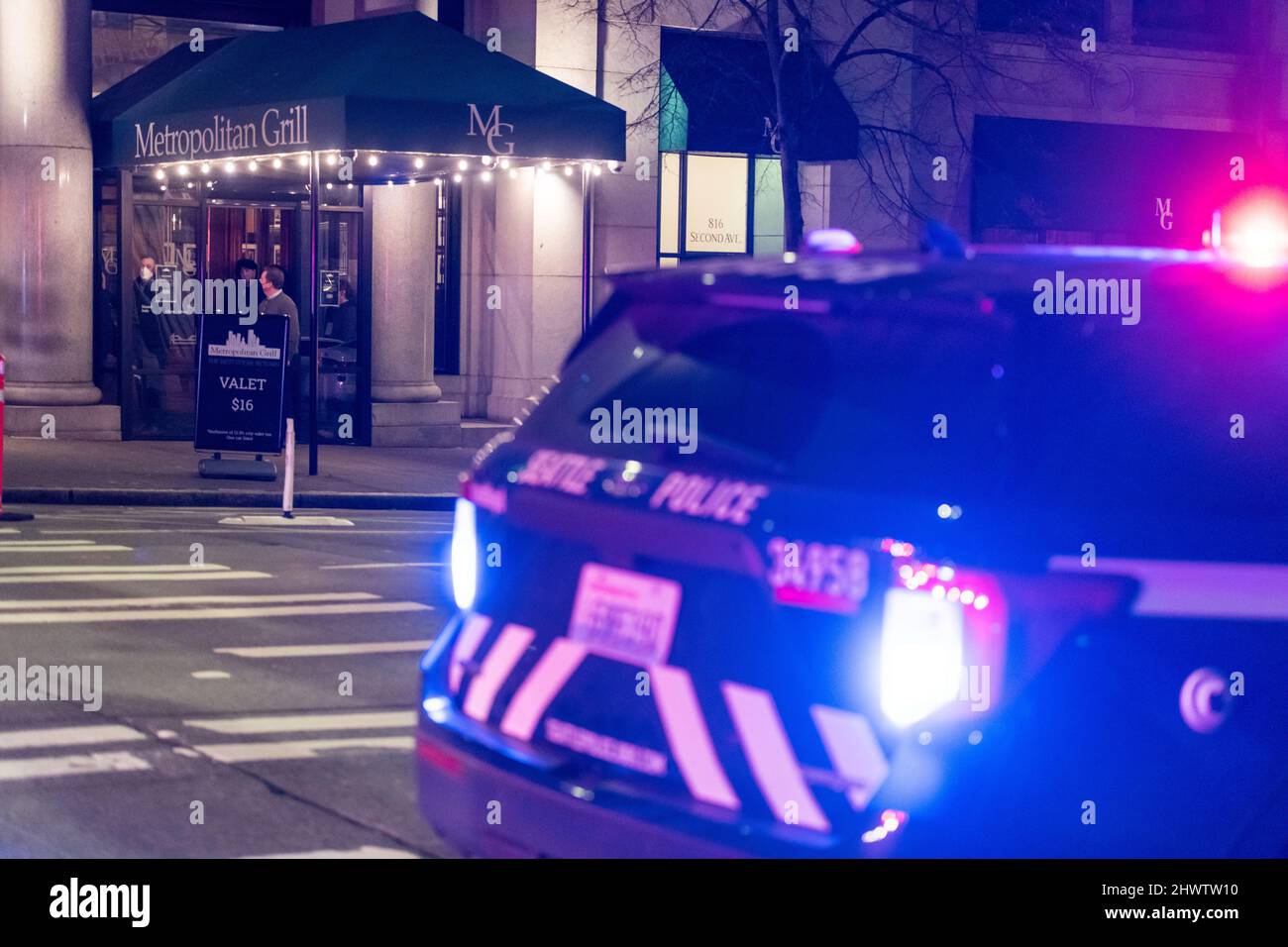 Seattle, USA. 5th Mar, 2022. Just after 8:00pm people watching a police ...