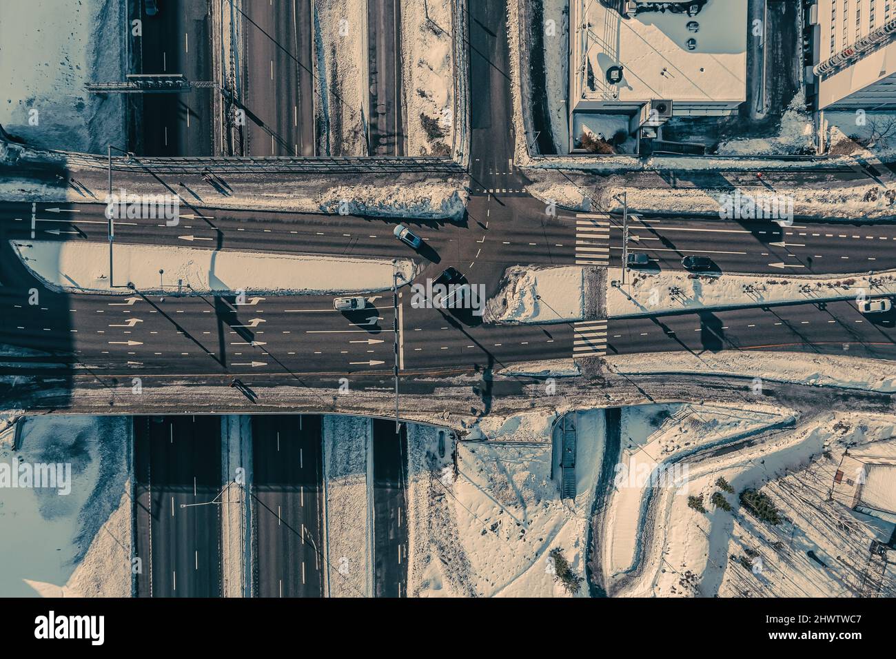 Aerial view of the highway and intersection in the city on a winter day ...