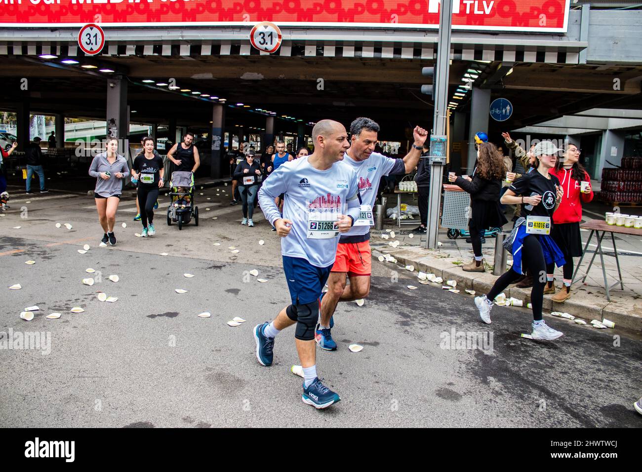 Tel Aviv, Israel - February 25, 2022 Runners in the street of Tel Aviv ...
