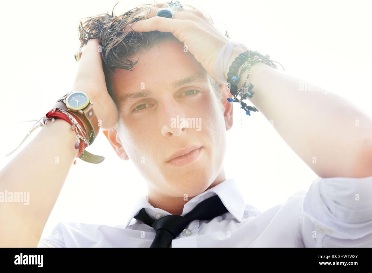 His style is steamy. Low angle portrait of a handsome and stylish young ...