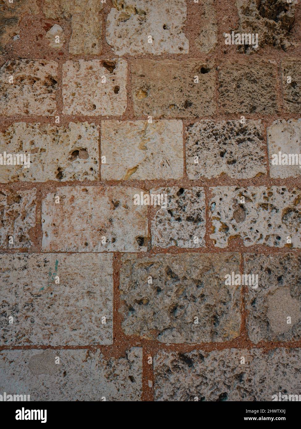 Old gray brick wall. Photo of surface of vintage stony wall. Wide angle ...