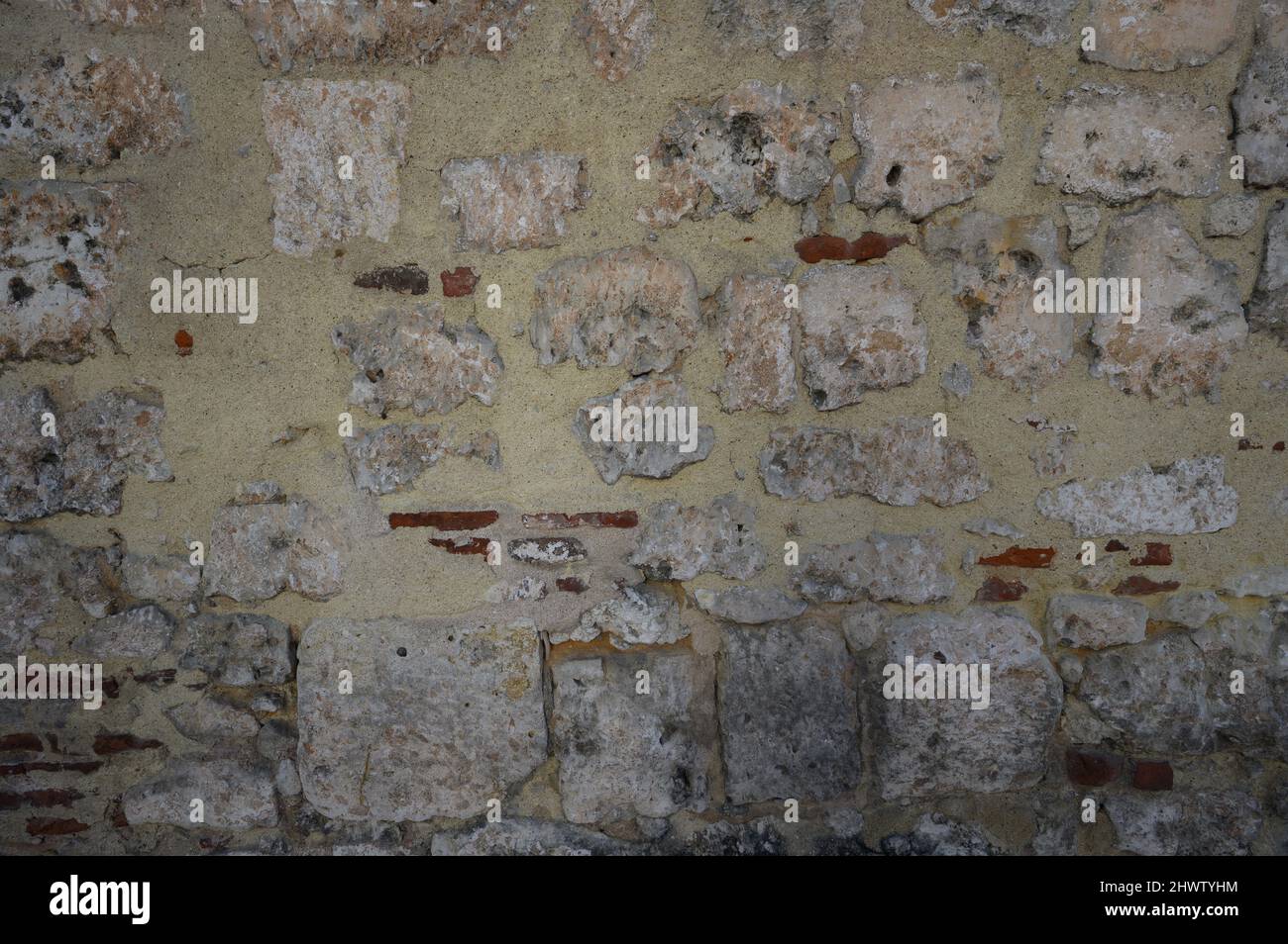 Old gray brick wall. Photo of surface of vintage stony wall. Wide angle ...