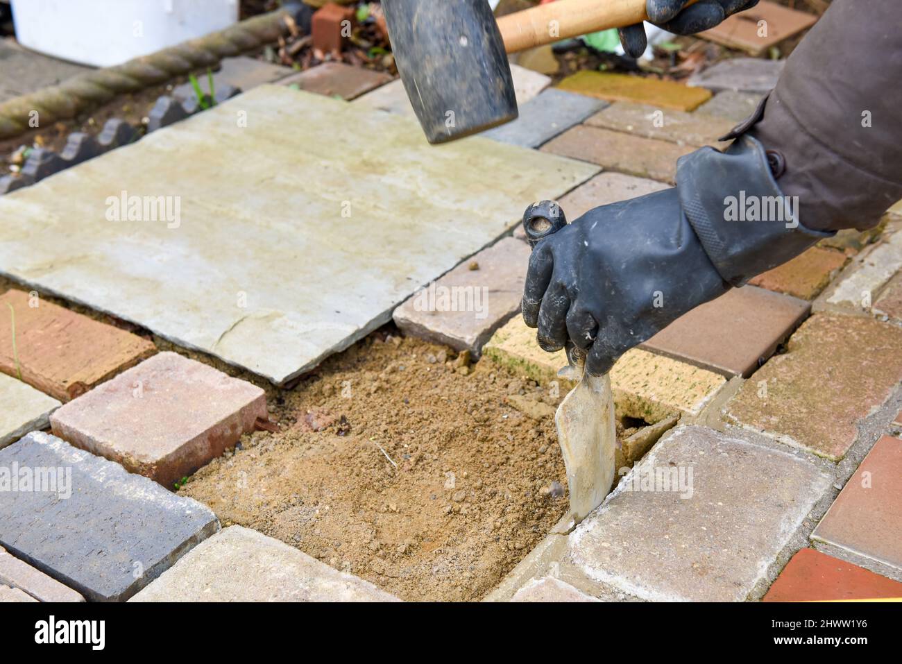 Laying a patio with stone concrete and tools of the trade Stock Photo ...