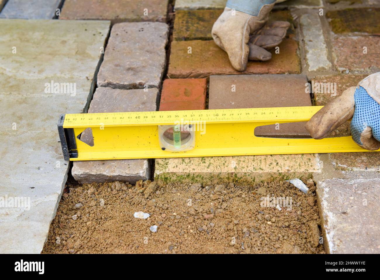 Laying a patio with stone concrete and tools of the trade Stock Photo ...