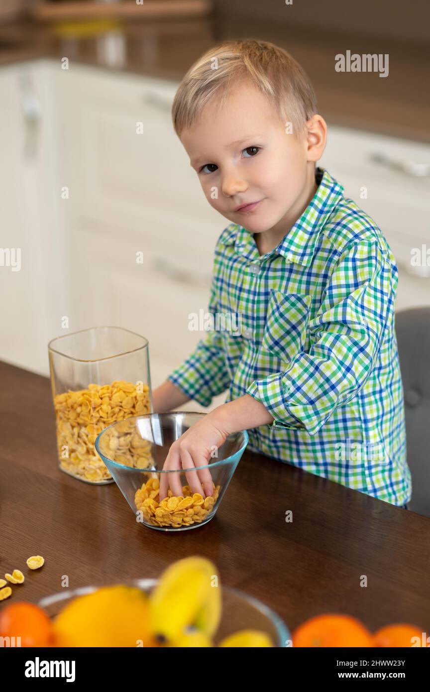 Child making breakfast hi-res stock photography and images - Alamy
