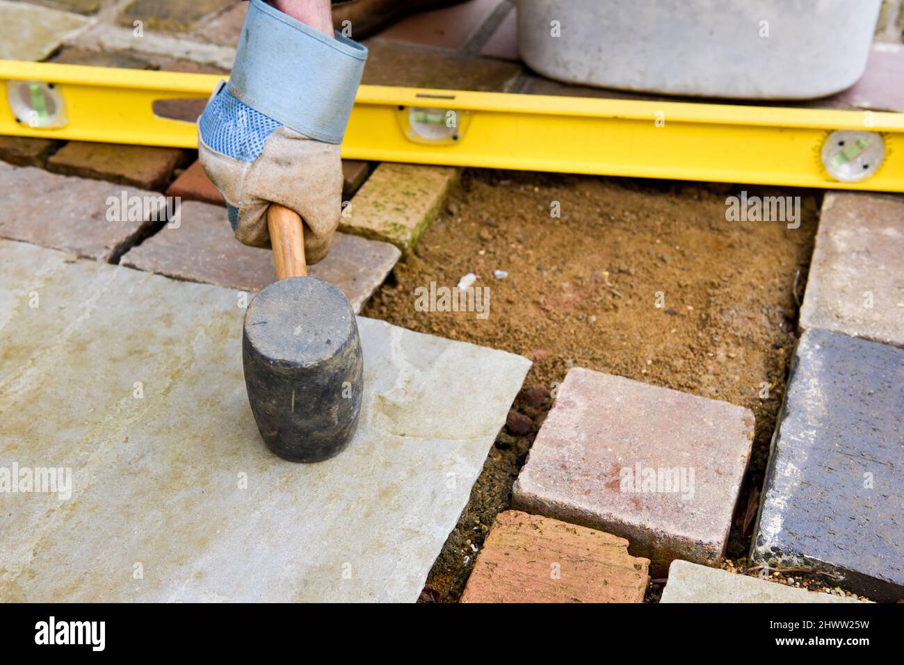 Laying a patio with stone concrete and tools of the trade Stock Photo ...