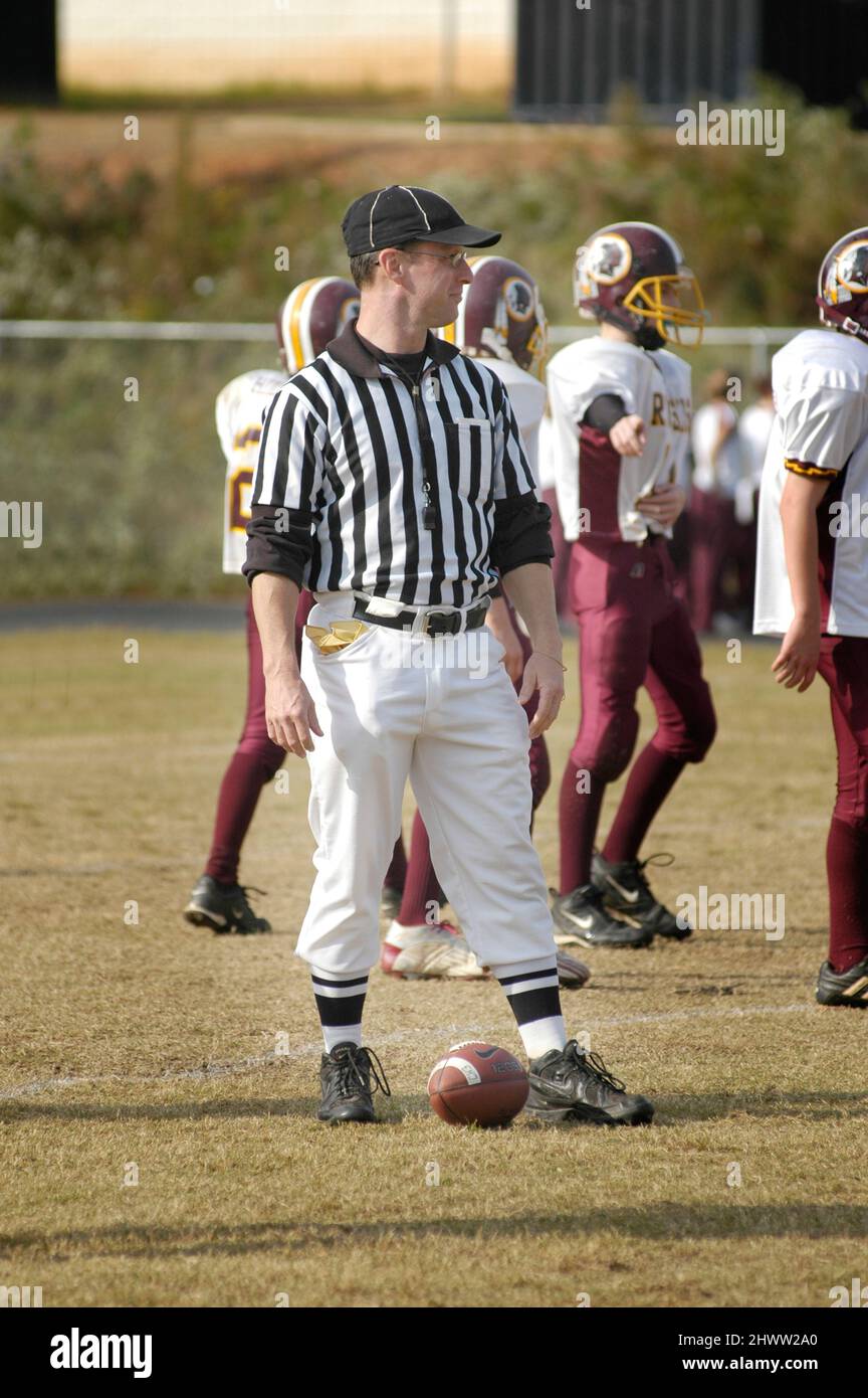 Referee at football game for youth Stock Photo - Alamy