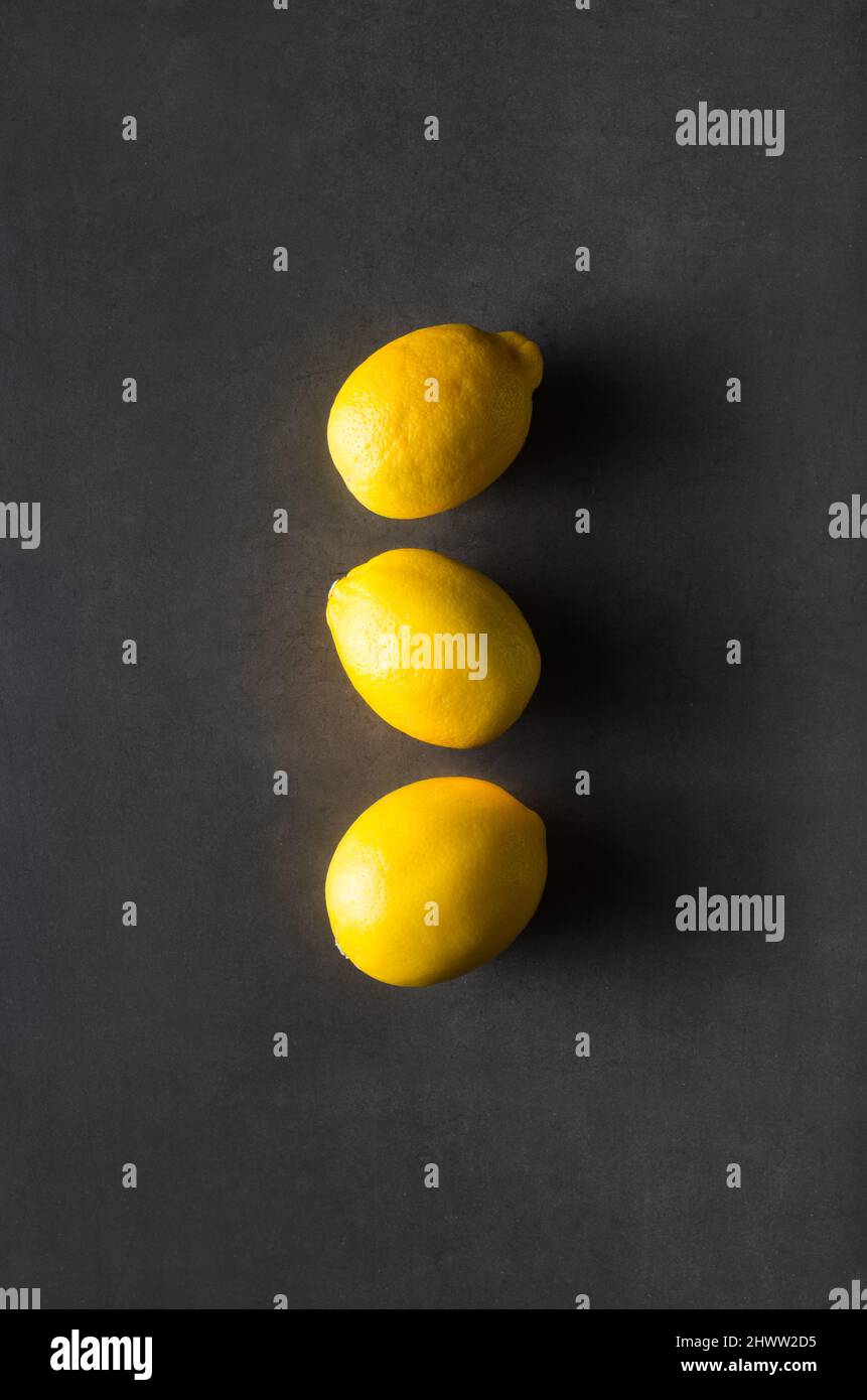 Lemons on a dark grey metal background Stock Photo - Alamy