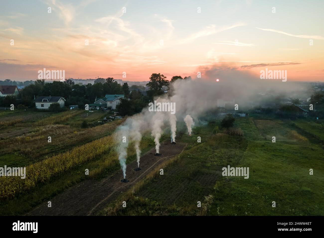 Aerial view of agricultural waste bonfires from dry grass and straw ...