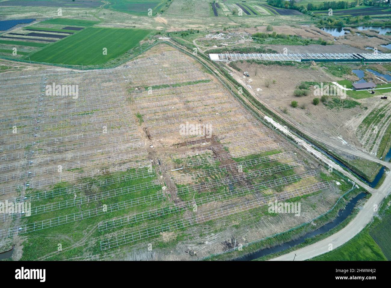 Aerial view of big electric power plant under construction with many ...
