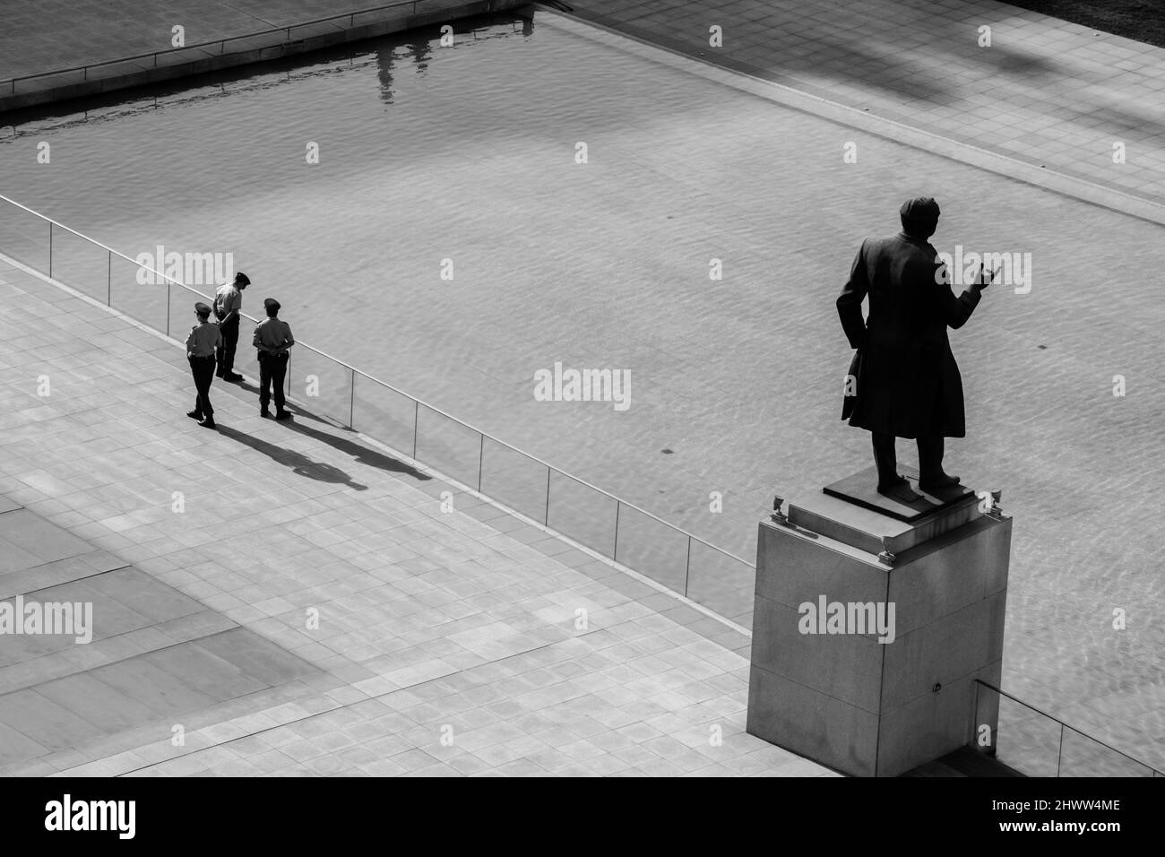 three police officers stand guard outside the government palace in ...