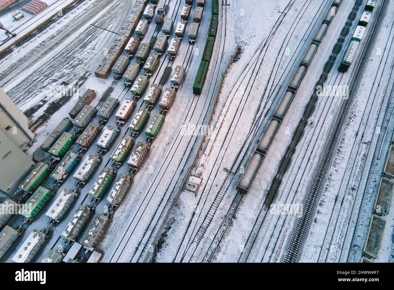 Aerial view of cargo train cars loaded with construction goods at ...