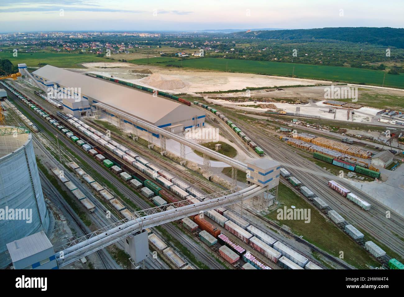 Aerial view of cargo train cars loaded with construction goods at ...