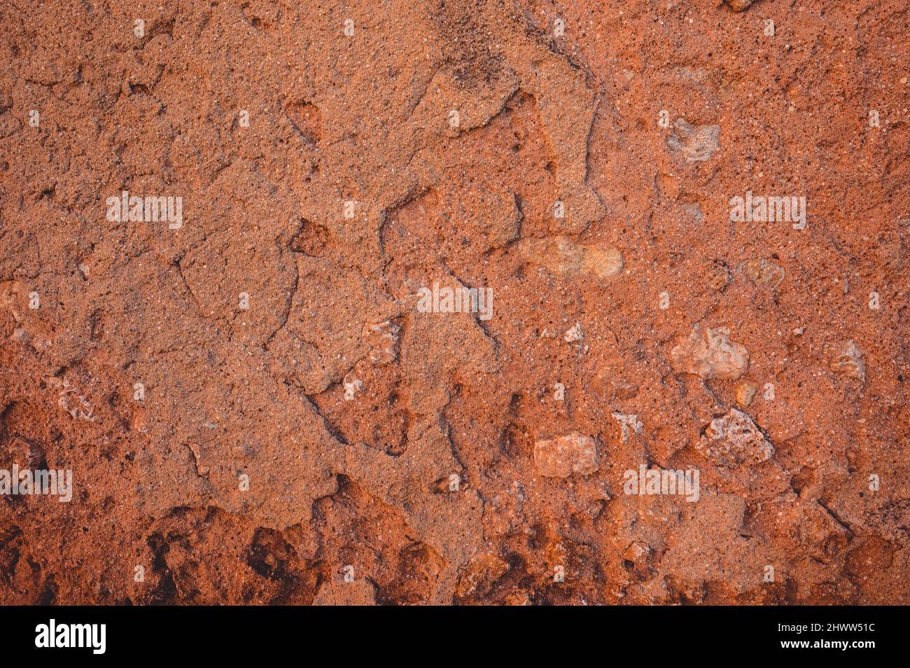 Vintage red clay wall. Photo of surface of vintage stony wall. Wide ...
