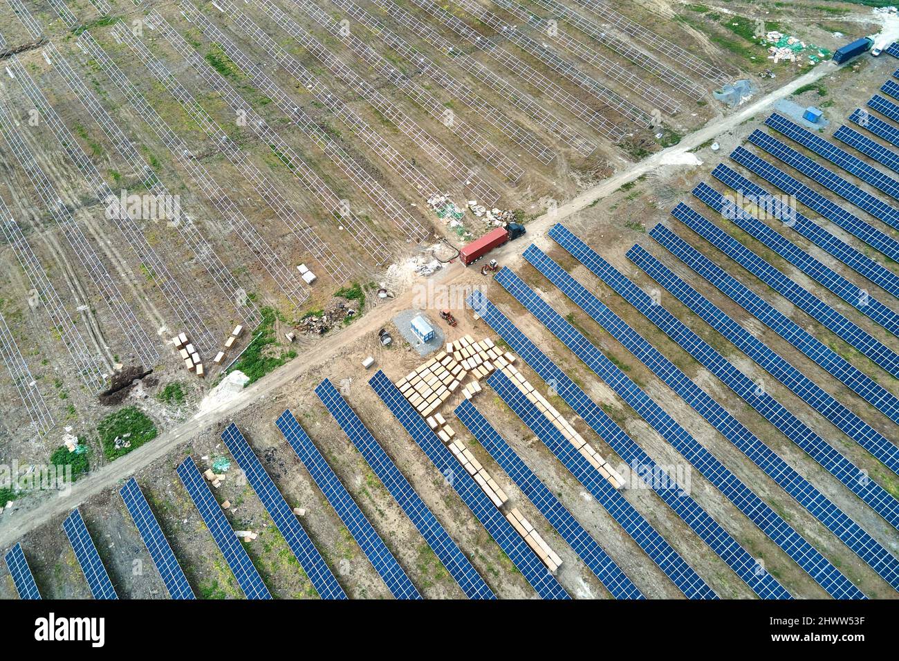 Aerial view of electrical power plant under construction with truck ...