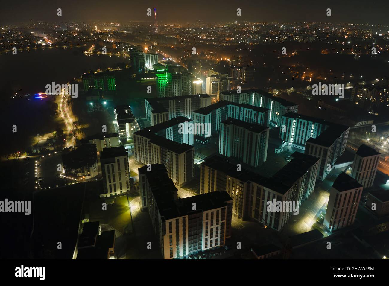 Aerial view of high rise apartment buildings and bright illuminated ...