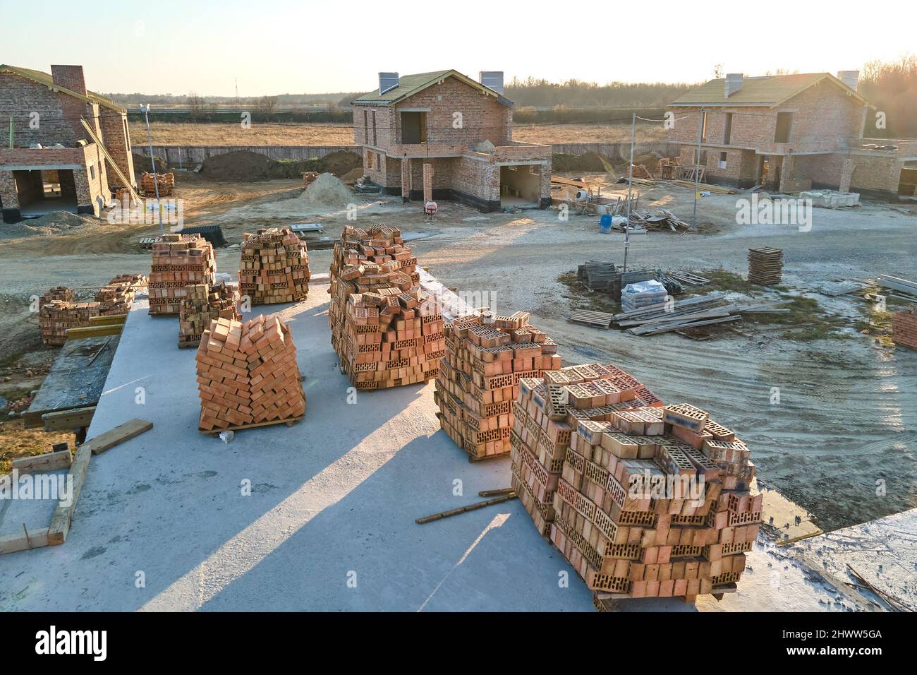 Aerial view of new homes with brick framework walls under construction ...