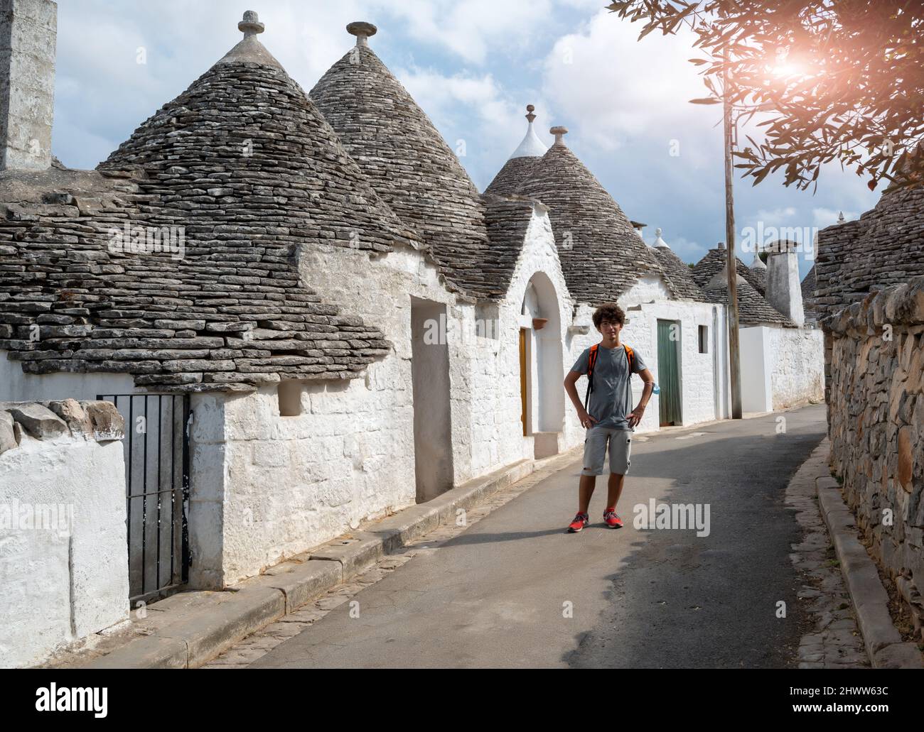 Alberobello, Puglia, Italy. August 2021. Amazing daytime view an alley ...