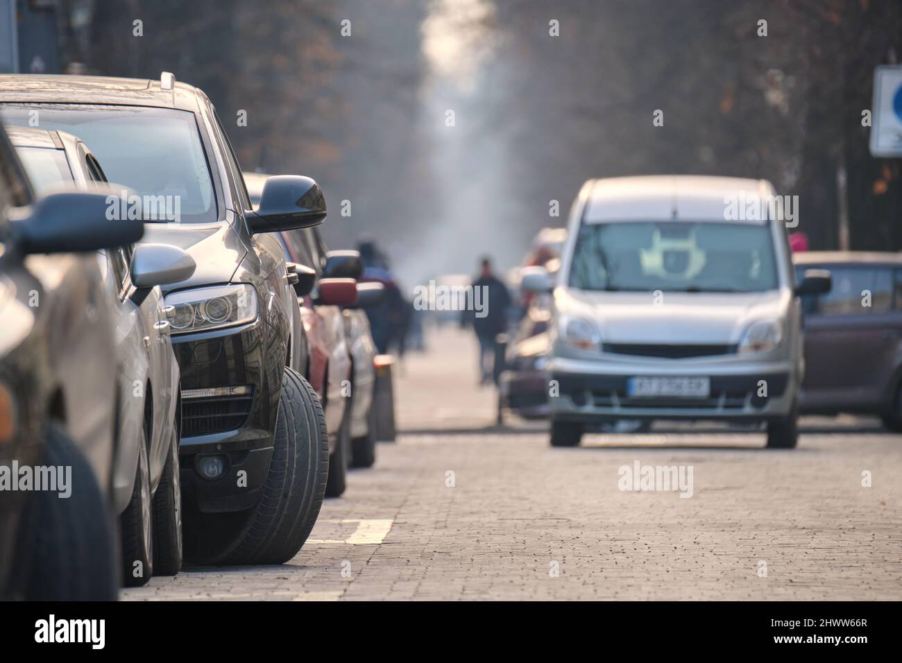 City traffic with cars parked in line on street side Stock Photo - Alamy