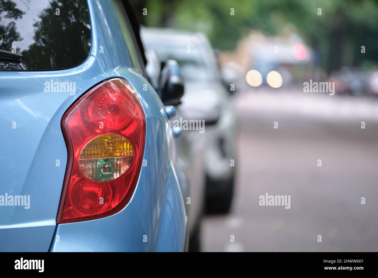Cars parked in line on city street side. Urban traffic concept Stock ...