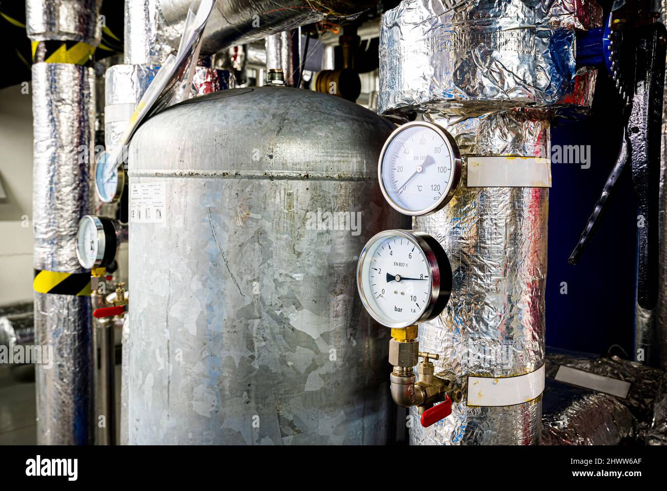 Barometers on pressure pipes, underground premises of the factory Stock ...