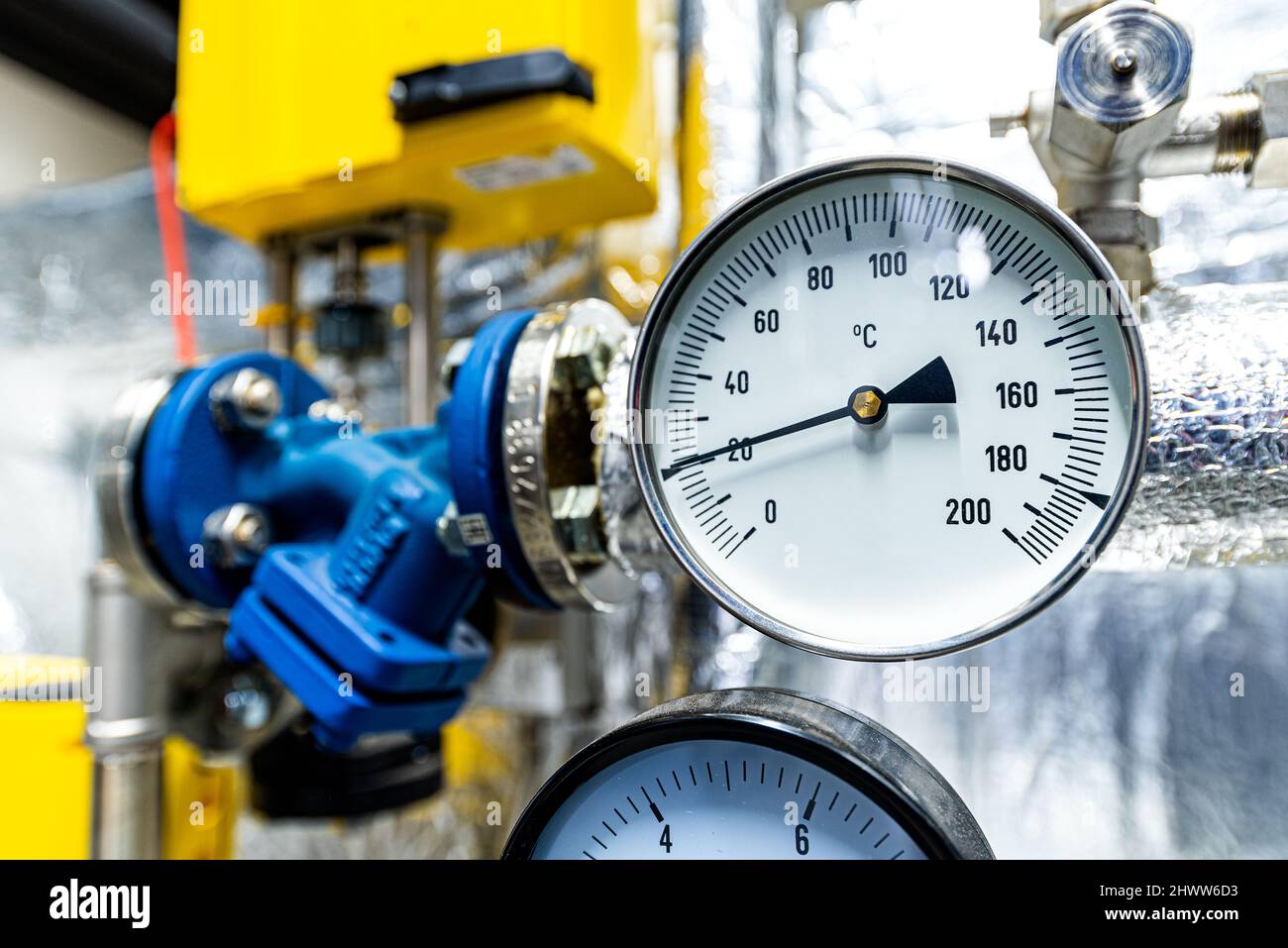 Barometers on pressure pipes, underground premises of the factory Stock ...