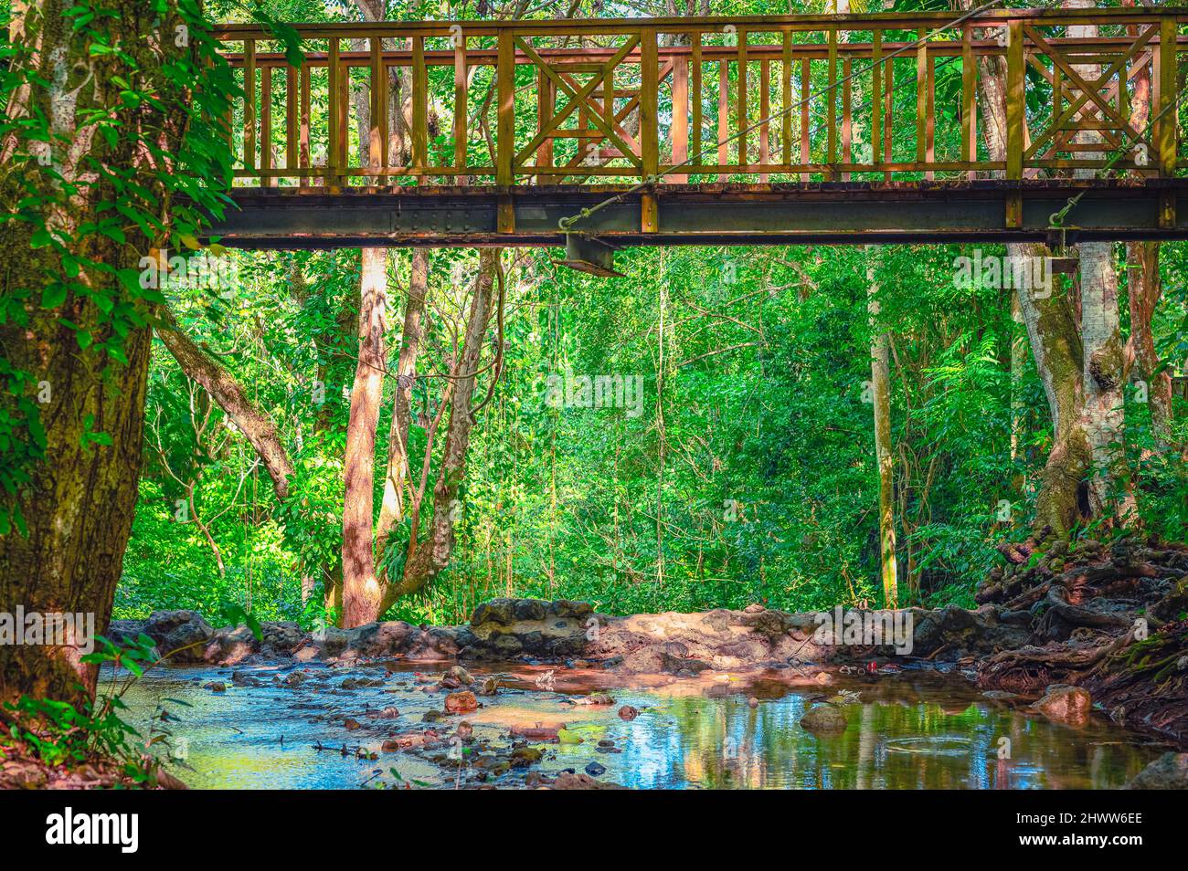 Tourist bridge with wooden railings. Stone bridge construction ...