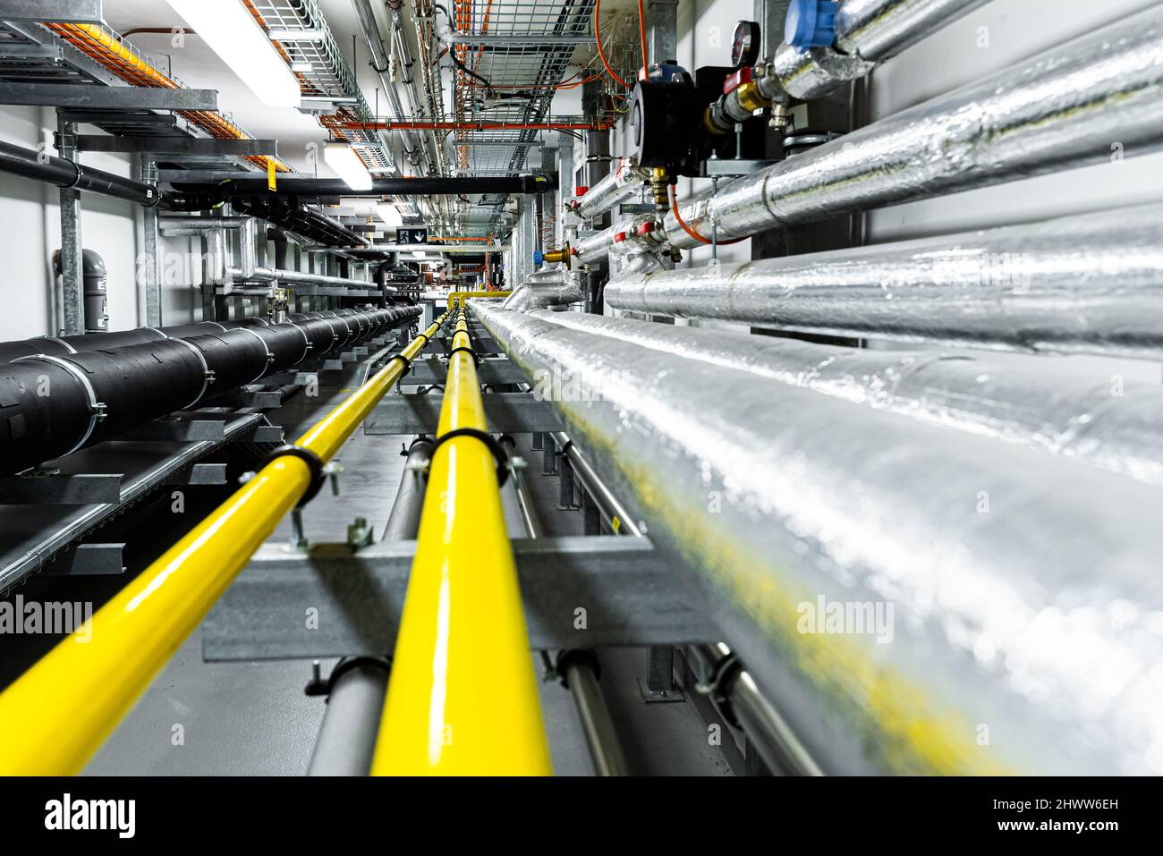 Gas and waste pipelines in the underground premises of the factory ...