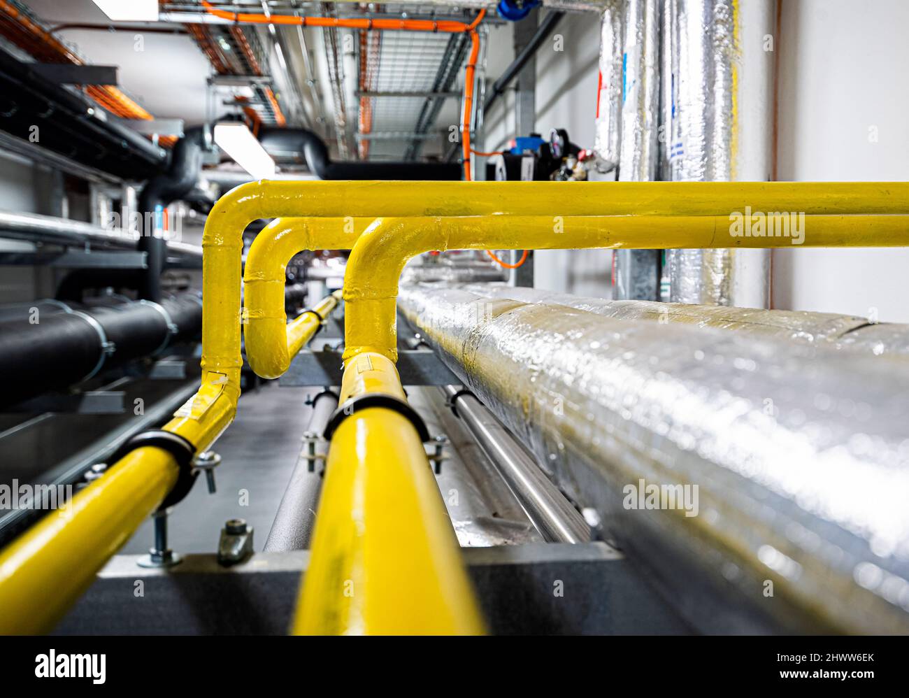 Gas and waste pipelines in the underground premises of the factory ...