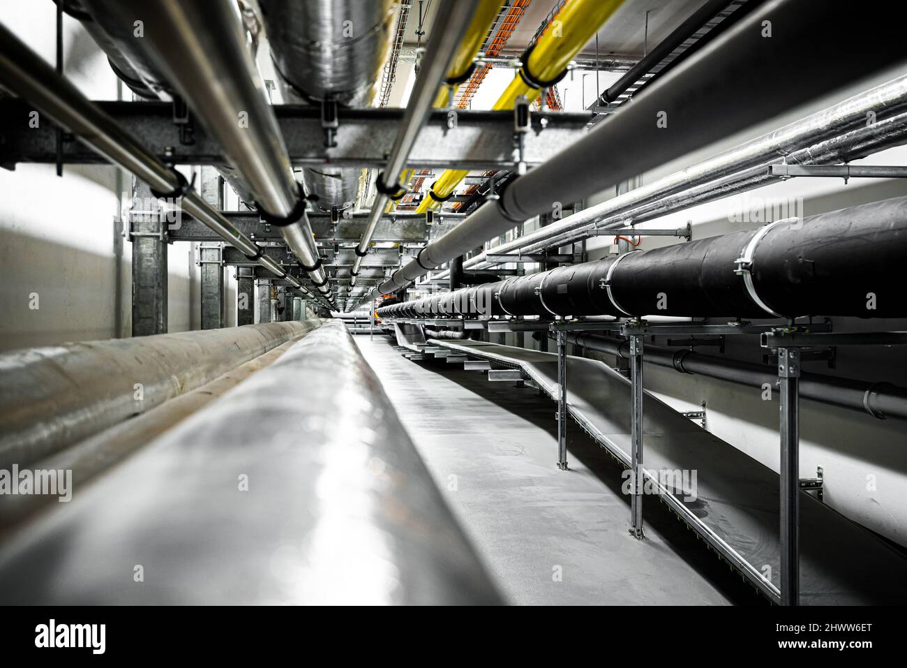 Gas and waste pipelines in the underground premises of the factory ...