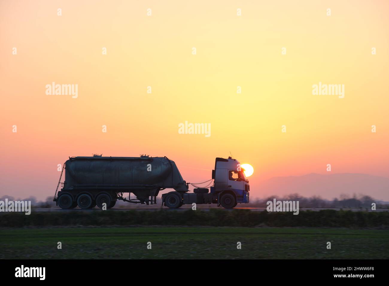 Petrol cargo truck driving on highway hauling oil products. Delivery ...