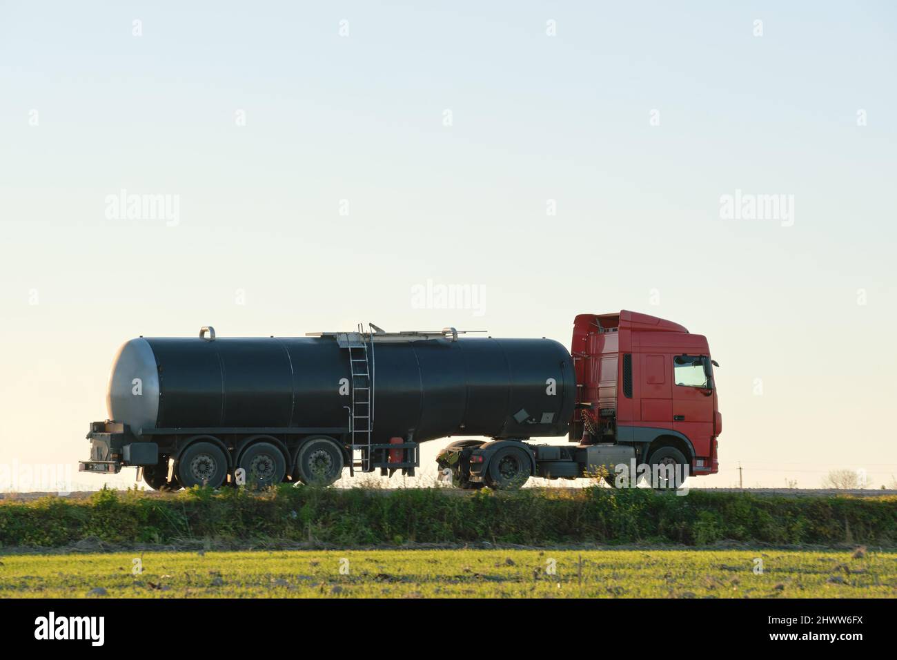 Petrol cargo truck driving on highway hauling oil products. Delivery ...