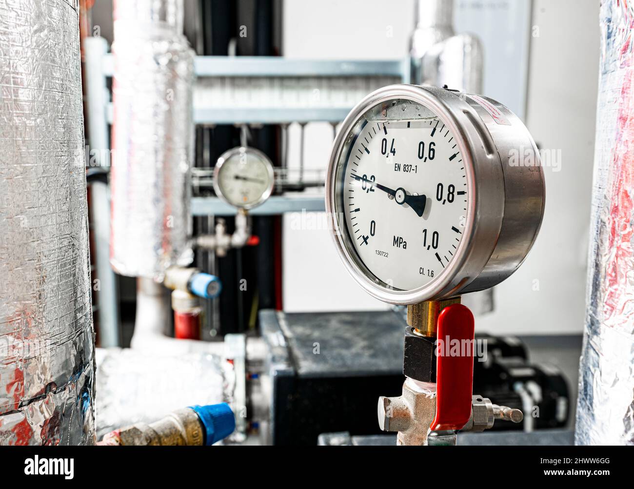 Barometers on pressure pipes, underground premises of the factory Stock ...