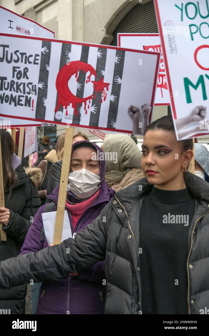 A large crowd marches during the International Women's Day protest in ...