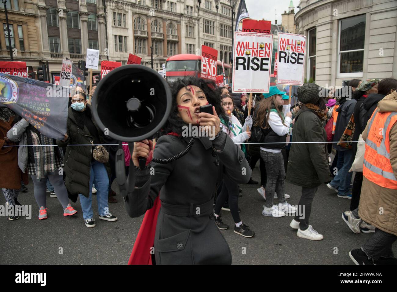 A large crowd marches during the International Women's Day protest in ...