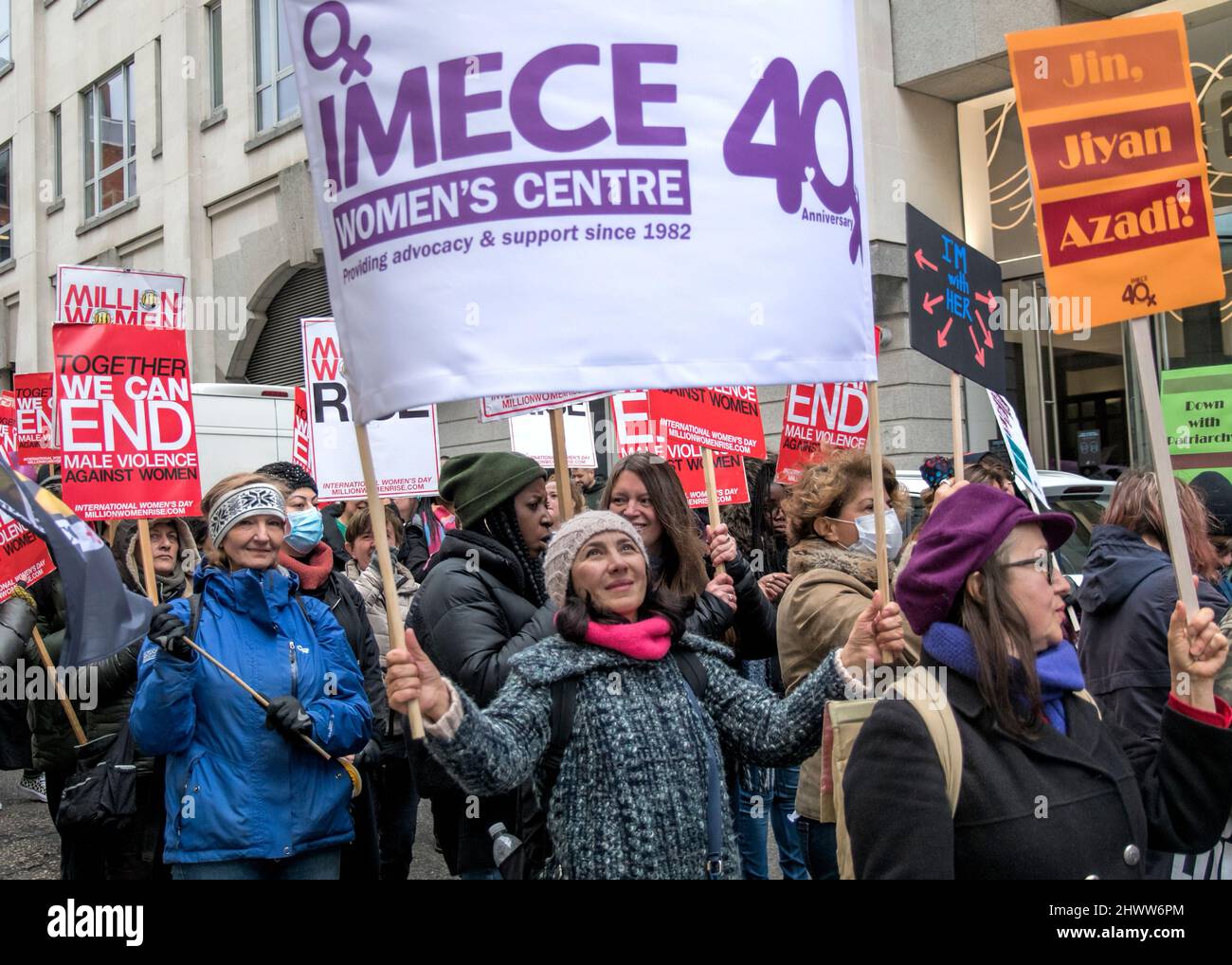 A large crowd marches during the International Women's Day protest in ...