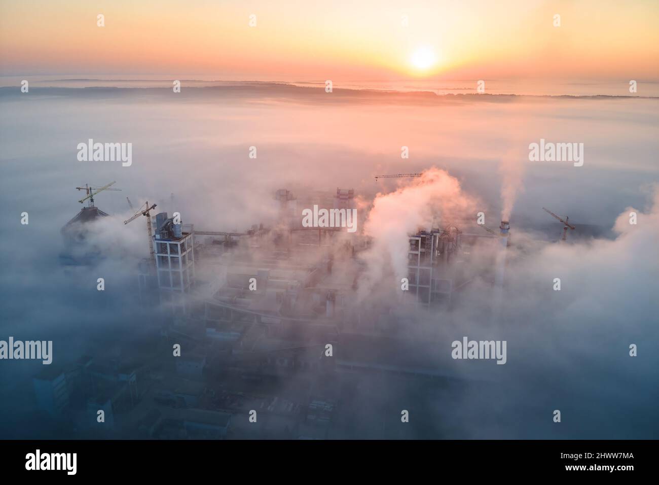 Aerial view of cement factory with high concrete plant structure and ...