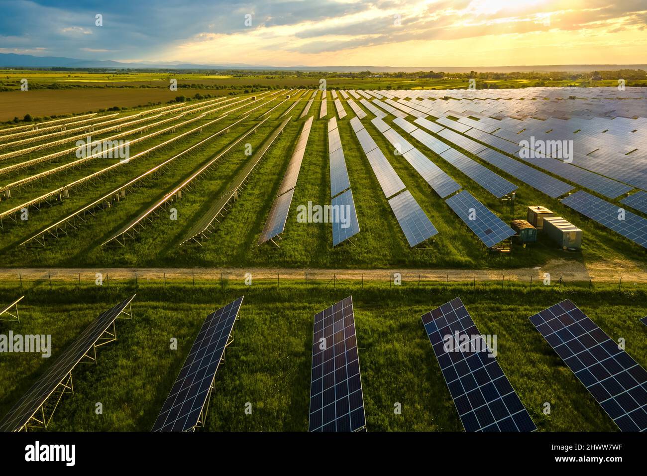 Aerial view of large sustainable electrical power plant with many rows ...