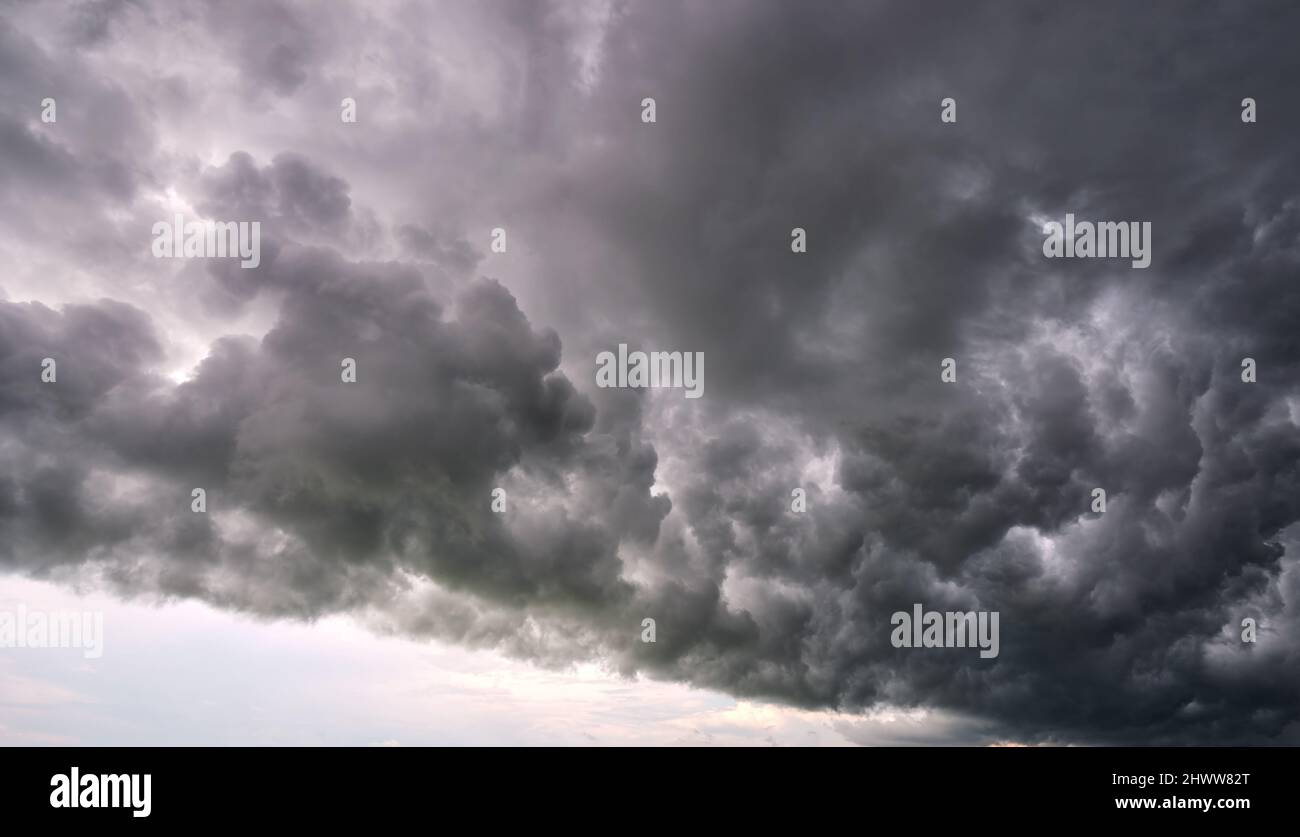 Landscape of dark ominous clouds forming on stormy sky during heavy ...