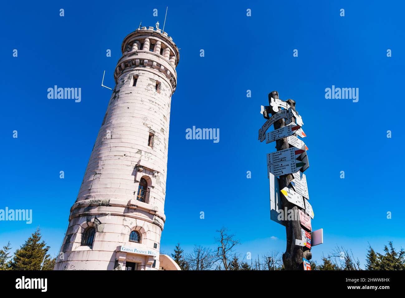 Owl Mountains, Poland - April 2021: Small square with old viewing tower ...