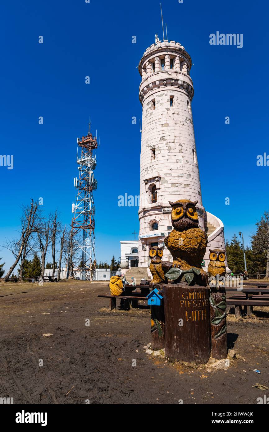 Owl Mountains, Poland - April 2021: Small square with old viewing tower ...