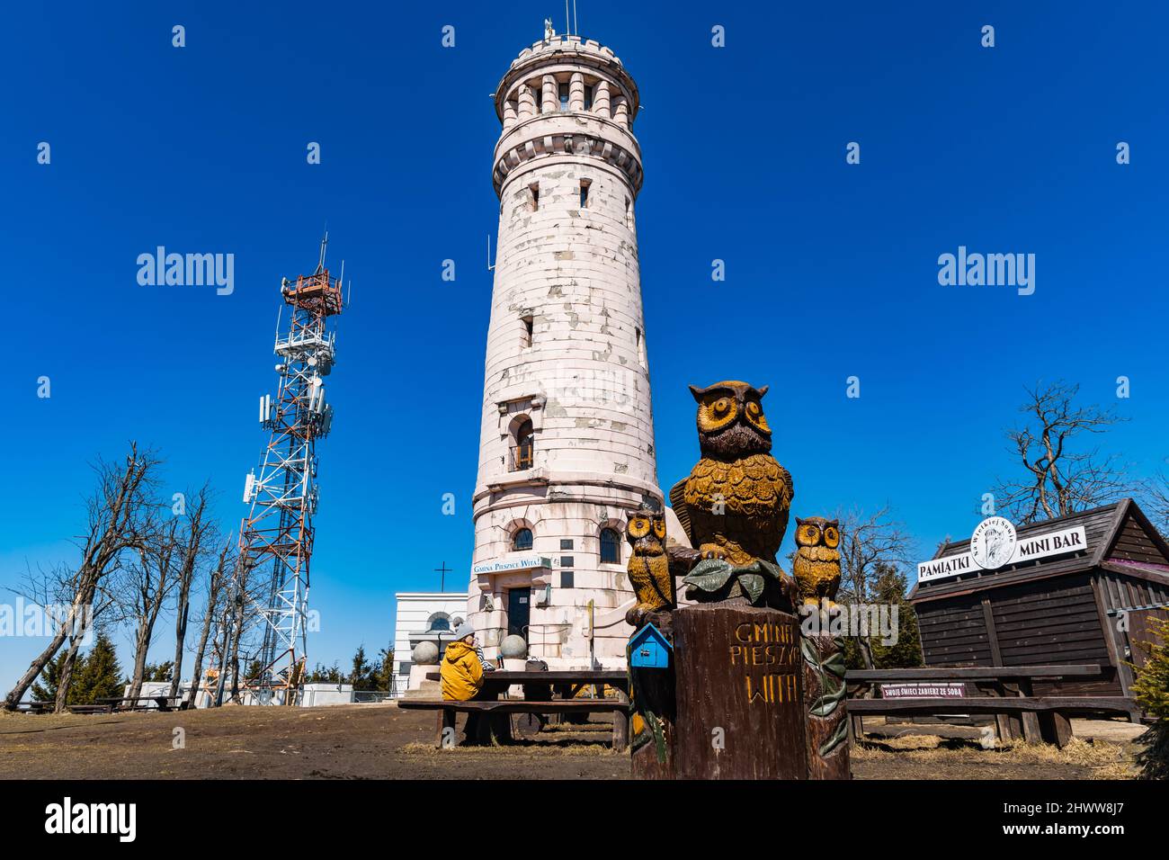 Owl Mountains, Poland - April 2021: Small square with old viewing tower ...