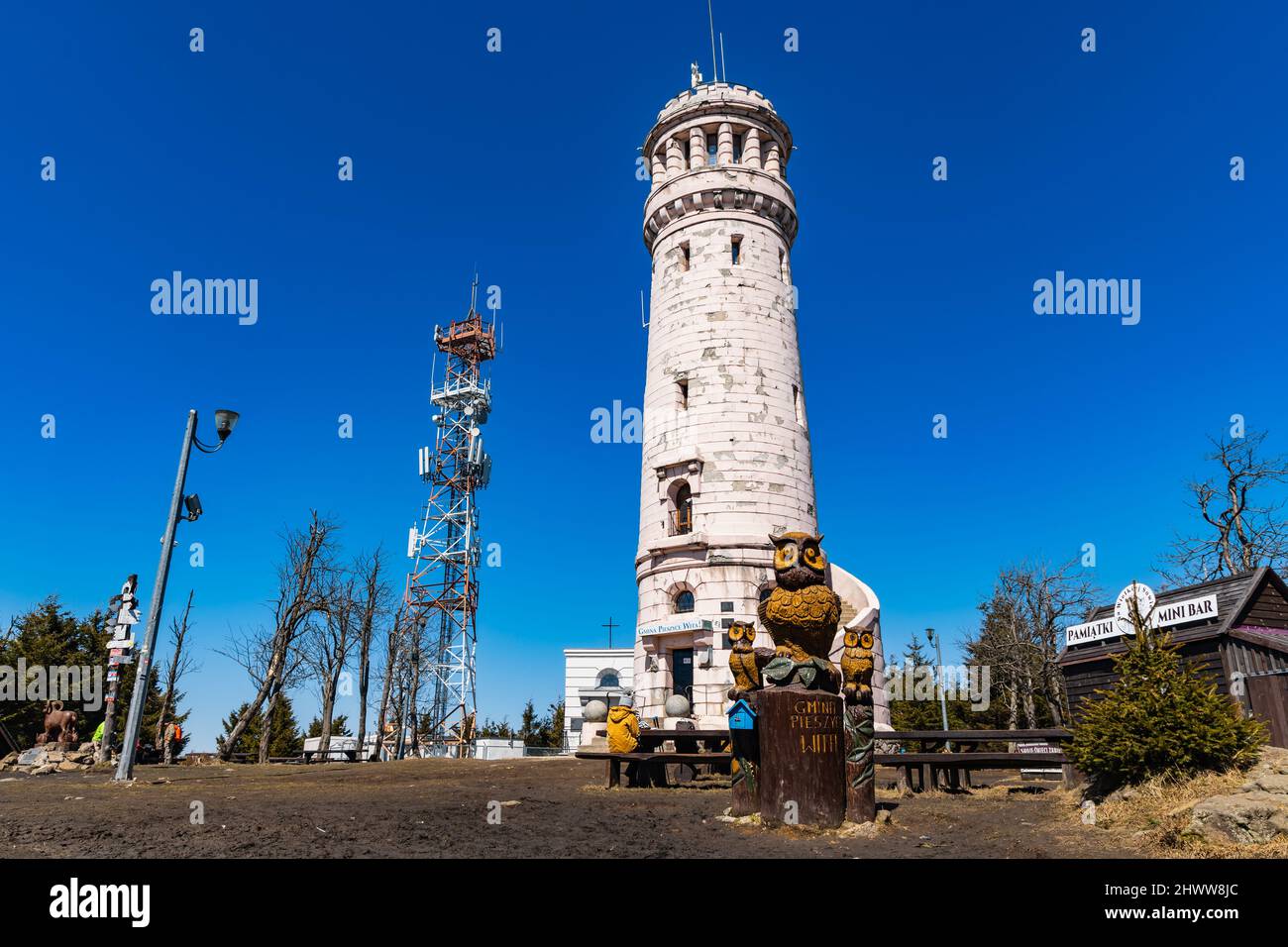 Owl Mountains, Poland - April 2021: Small square with old viewing tower ...
