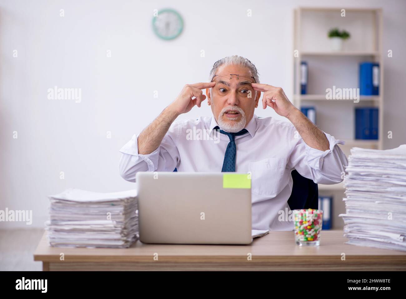 Old businessman employee suffering hi-res stock photography and images ...