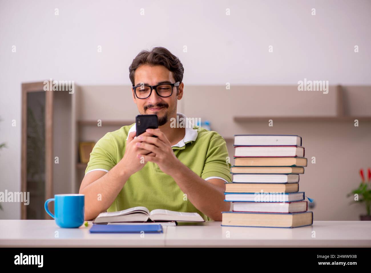 Young student studying at home Stock Photo - Alamy
